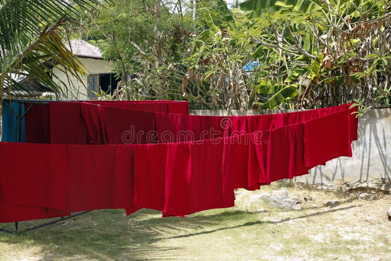 Laundry drying in the sun stock photo. Image of work - 142439000