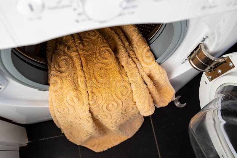 Laundry in an Open Washing Machine in the Bathroom Stock Photo - Image ...