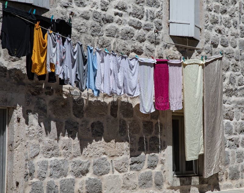 Laundry stock image. Image of towels, rock, shirts, laundry - 249747161