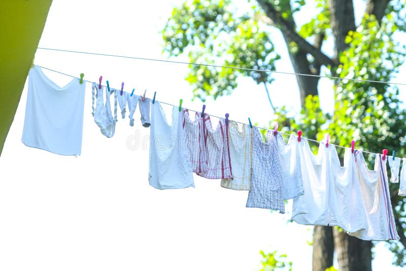 Laundry Hanging on Washing Line Stock Photo - Image of outside, clean ...