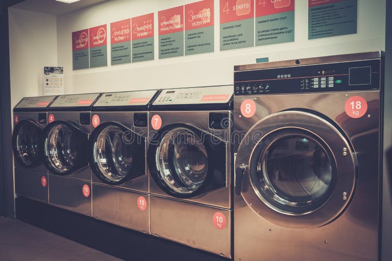 Laundry Machines at Laundromat Shop. Stock Photo - Image of laundrette ...