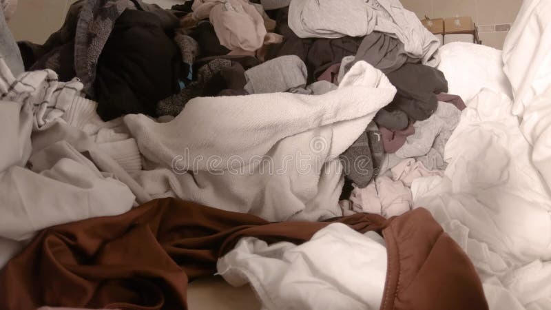 Laundry Piling Up in the Bathroom - Slider Shot Stock Footage - Video ...