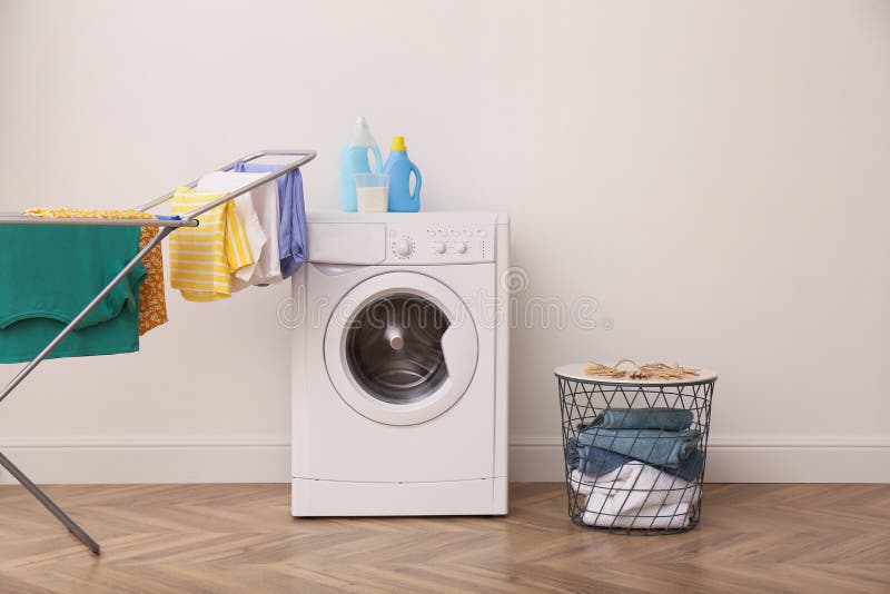Laundry Room Interior with Modern Washing Machine and Drying Rack Stock ...
