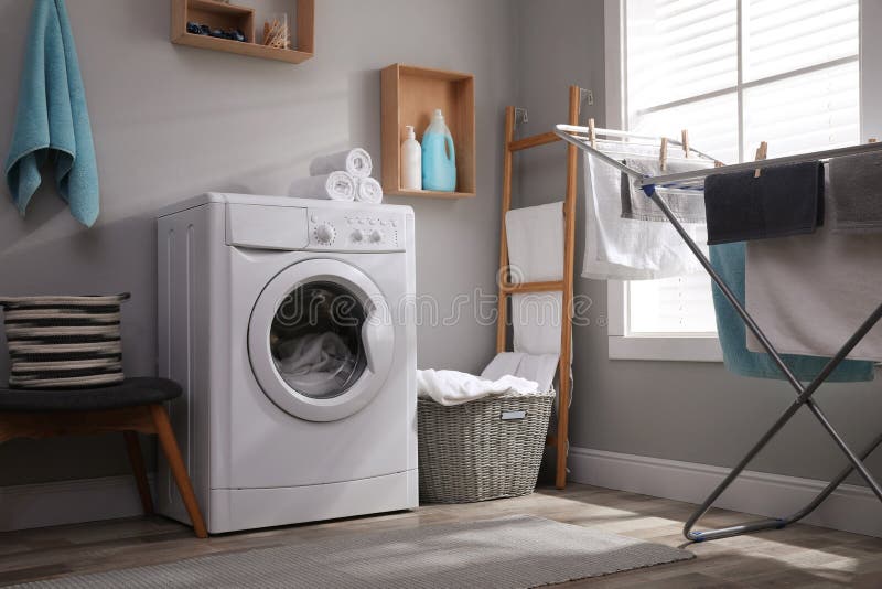 Laundry Room Interior with Modern Washing Machine Near Light Wall Stock ...