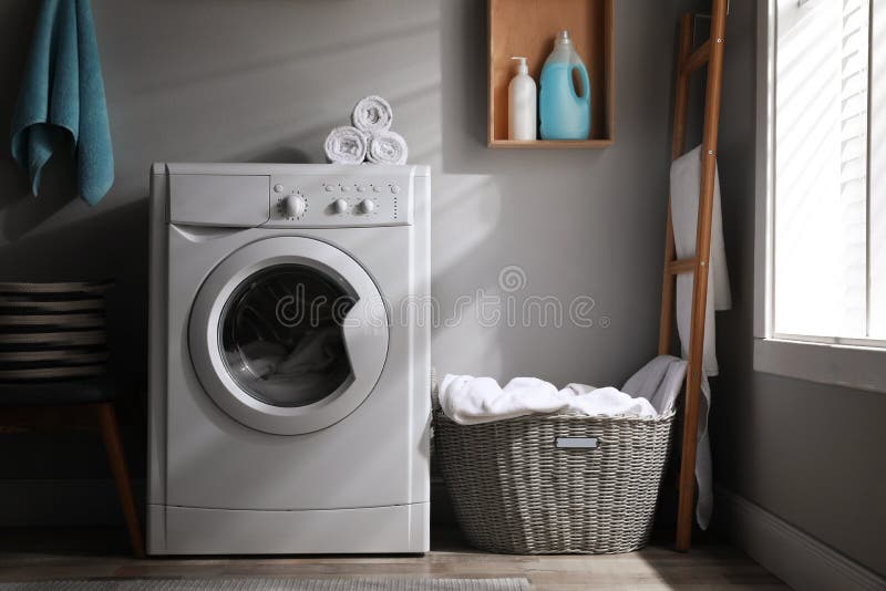 Laundry Room Interior with Modern Washing Machine Near Light Wall Stock ...