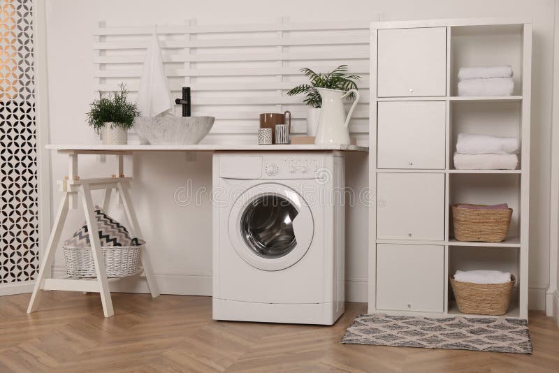Laundry Room Interior with Modern Washing Machine and Shelving Unit ...
