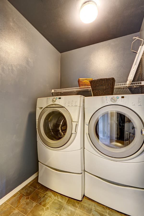 Laundry Room with Tile Floor, Washer, and Dryer. Stock Image - Image of ...