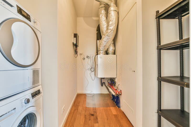 A Laundry Room with a Sink and a Washing Machine Stock Image - Image of ...