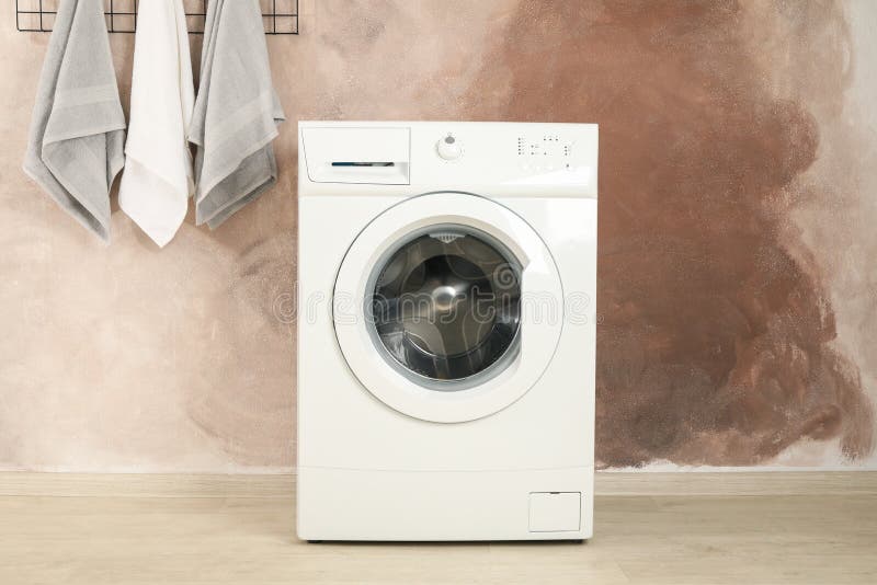 Laundry Room with Washing Machine Against Brown Stock Image - Image of ...
