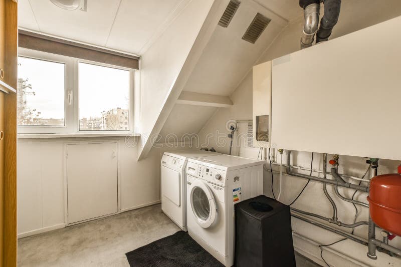 A Laundry Room with a Washing Machine and a Window Stock Image - Image ...