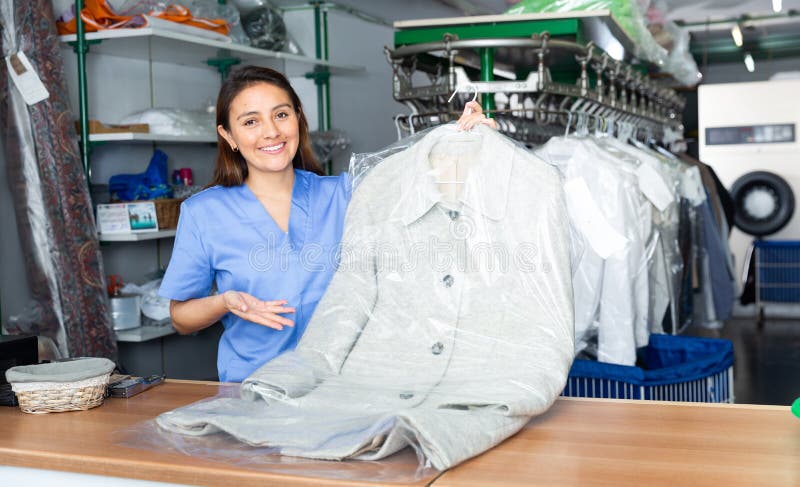 Laundry Worker Demonstrates Clean Clothes Stock Image - Image of ...