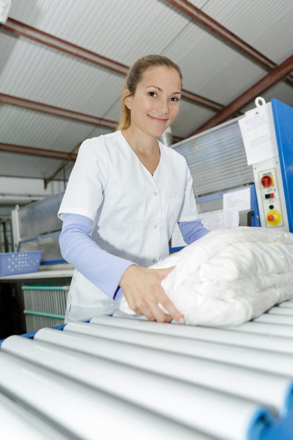 Laundry Worker at Dry Cleaners Stock Photo - Image of press, textile ...