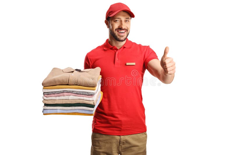 Laundry Worker Delivering a Pile of Folded Clothes Stock Photo - Image ...