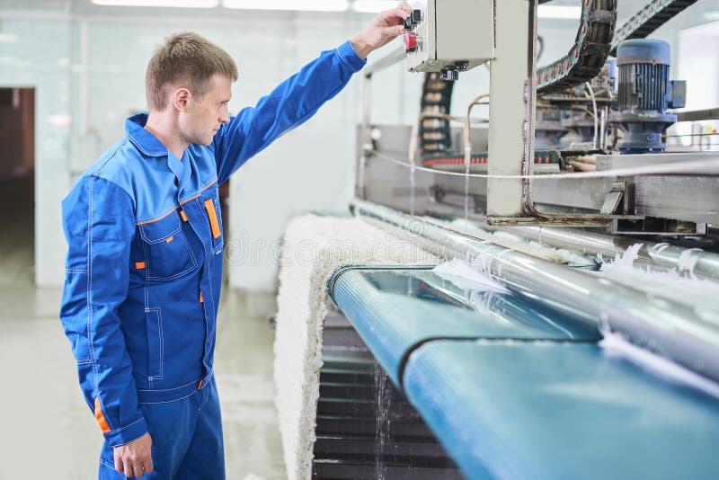 Laundry Worker in the Process of Working on Automatic Machine for ...