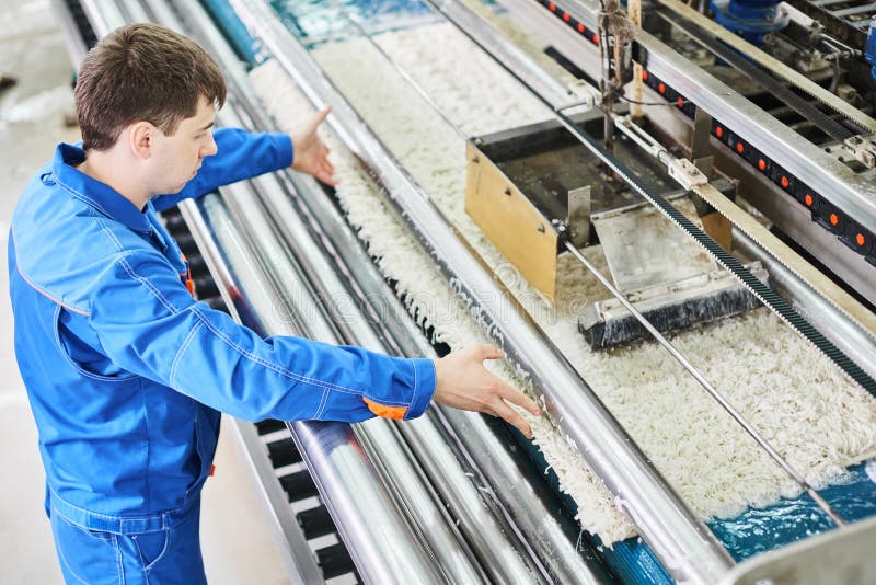 Laundry Worker in the Process of Working on Automatic Machine for ...