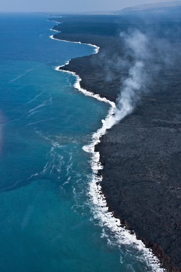 Lava Flowing into Ocean stock image. Image of tourism - 19957873
