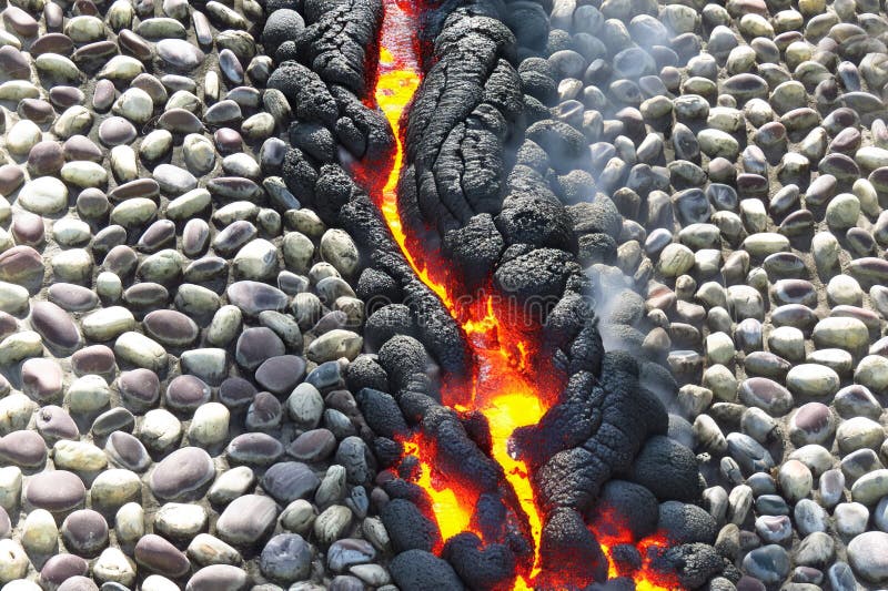 Lava Flowing through Pebbles Stock Image - Image of flow, flowing ...