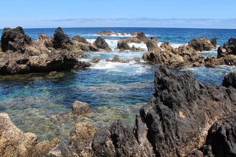 Lava pools in the ocean stock image. Image of water, clean - 46995445