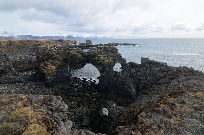 Lava Rock Formation Made into an Arch in Iceland Stock Image - Image of ...