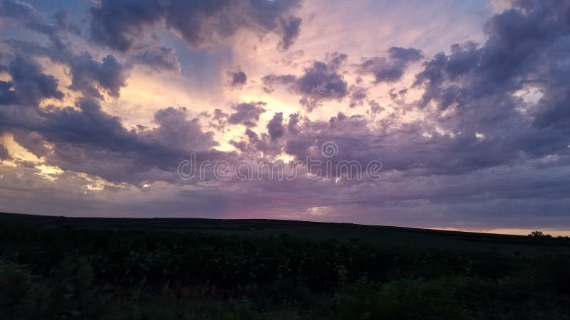 Lavender clouds rolling stock image. Image of beautiful - 156264885