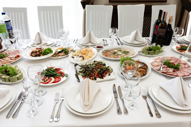 A Lavish Buffet Table Set for a Formal Event, Featuring an Array of Delicious Appetizers and ...