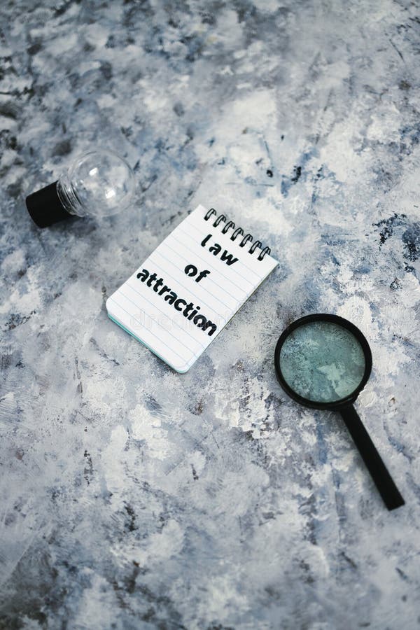 Law of Attraction Notepad with Light Bulb and Magnifying Glass Symbol ...