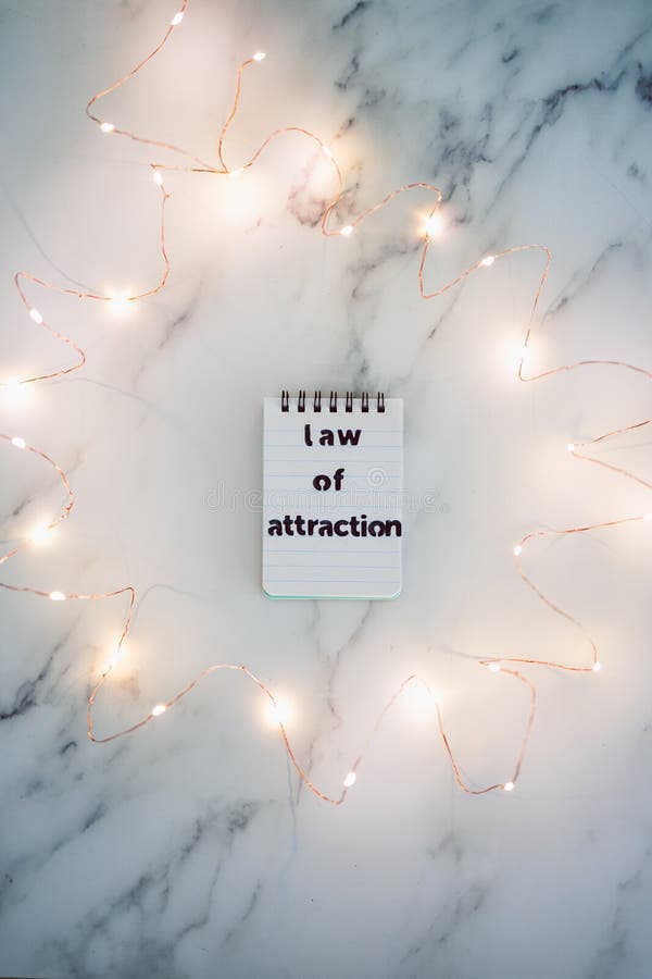 Law of Attraction, Text on Notepad Surrounded by Fairy Lights Stock ...