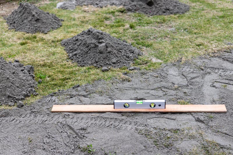 Lawn Leveling and Renovation Work with the Help of Using a Spirit Level ...