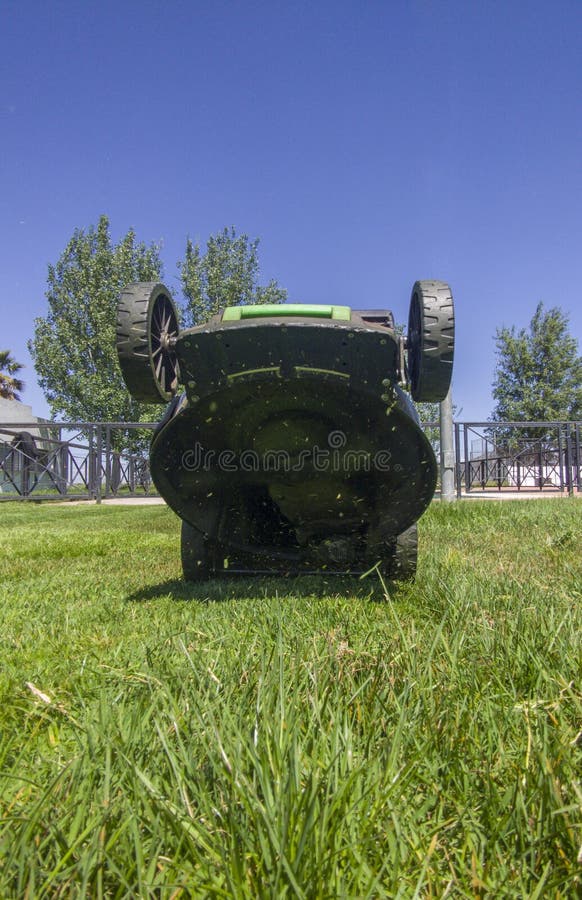 Lawn mower blade spinning stock image. Image of gardening - 357369791