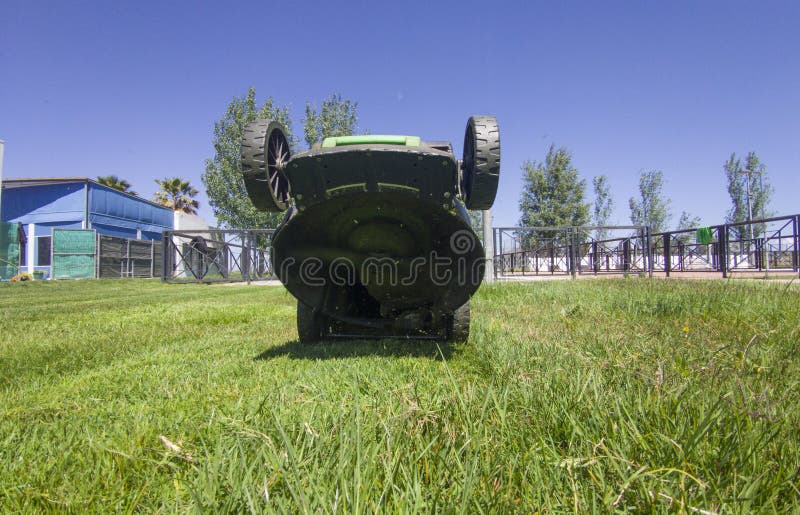Lawn mower blade spinning stock photo. Image of tracks - 357369806
