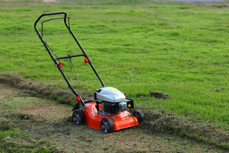 Lawn mower cutting grass stock image. Image of science - 52187375
