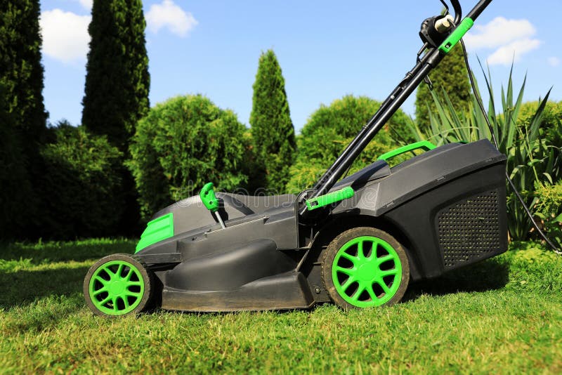 Lawn Mower on Green Grass in Garden Stock Image - Image of park ...