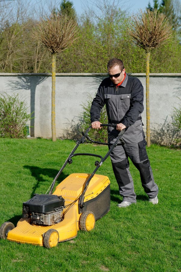 Lawn mower worker stock image. Image of machine, plot - 33016707
