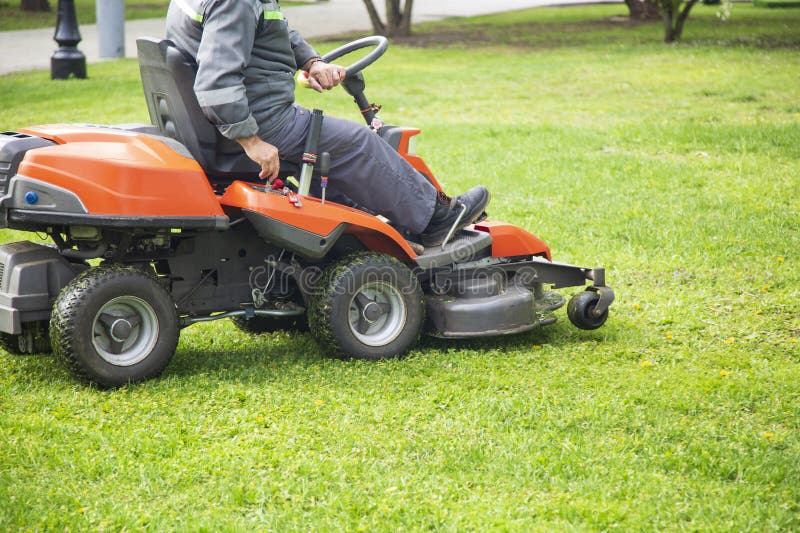 Lawn Mower. Mowing the Lawn by a Utility Worker Stock Photo - Image of ...