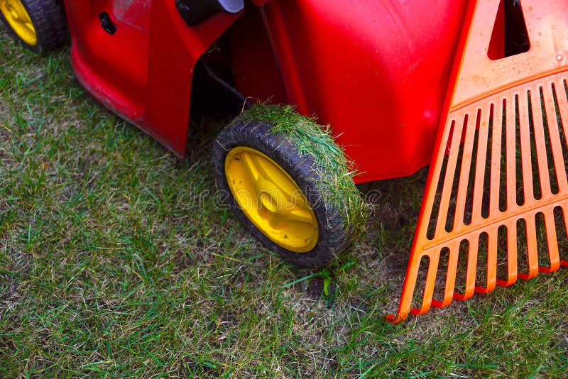 Lawn Mower and Rake. Autumn Accessories for Working in the Garden Stock ...