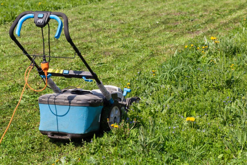 Lawn Mower in the Spring Garden Stock Photo - Image of knife, person ...