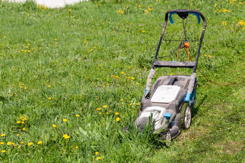 Lawn Mower in the Spring Garden Stock Image - Image of cultivate ...