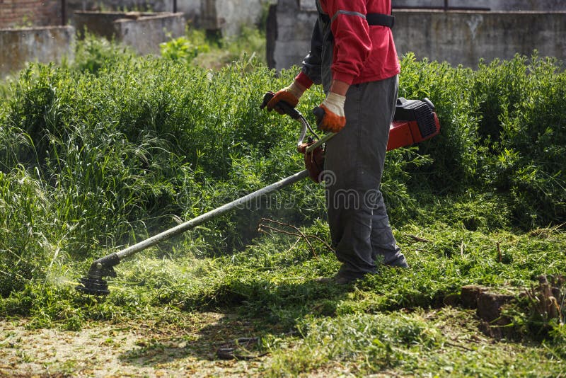 Lawn Mower Worker Cutting Grass In Green Field Stock Image - Image of ...