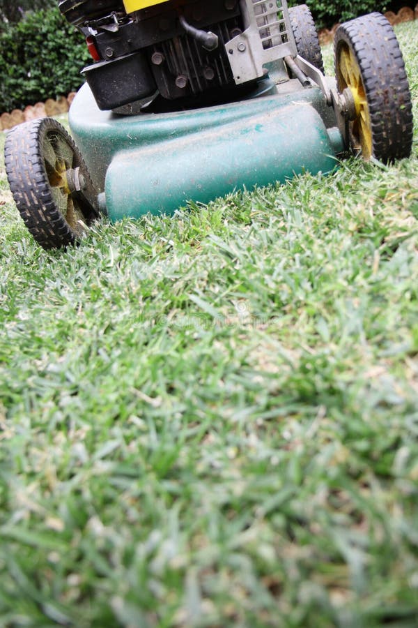 Mowing the lawn stock image. Image of house, equipment - 52325025