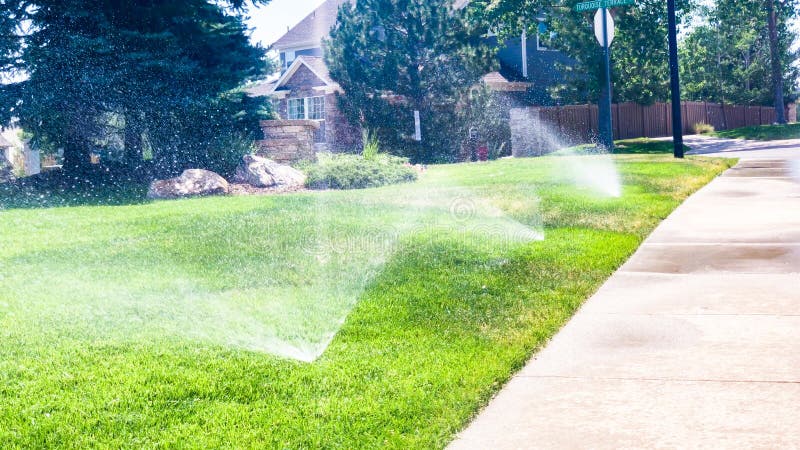 Lawn sprinkles stock photo. Image of suburbia, suburbs - 271206846
