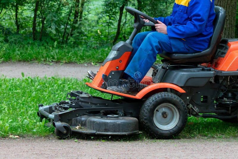 A Lawnmower Mows the Grass in the Park Stock Image - Image of cutting ...