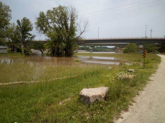 The Lawrence, Kansas Riverfront Flood Stock Photo - Image of waterway ...