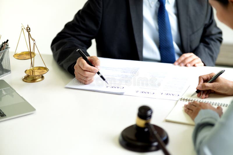 Lawyer is Giving Advice and Introduce a Pending Case To an Assistant ...