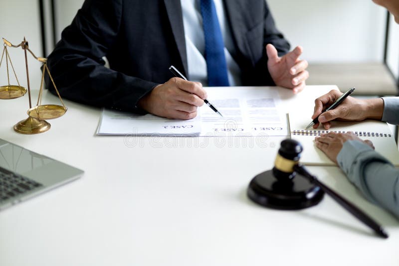 Lawyer is Giving Advice and Introduce a Pending Case To an Assistant ...