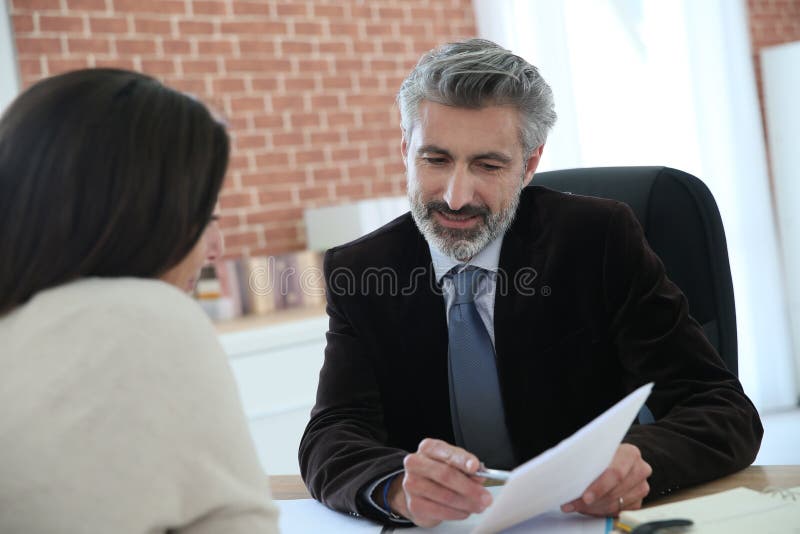 Lawyer Meeting Clients in His Office Stock Photo - Image of discussing ...