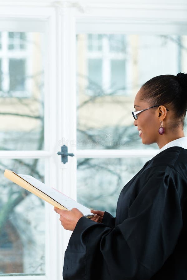 Lawyer in Office with Dossier Standing an Window Stock Photo - Image of ...