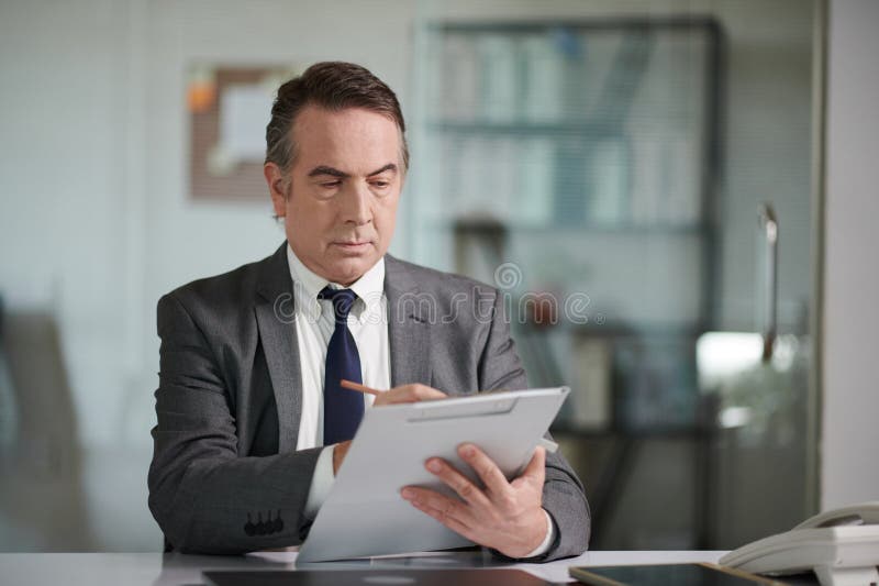 Lawyer Reading Case Papers stock photo. Image of table - 287793450