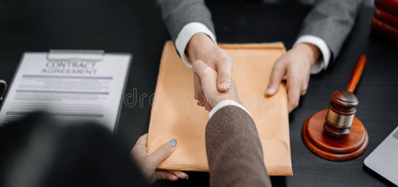 Lawyer Shaking Hands with Client after Discussing Final Contract ...