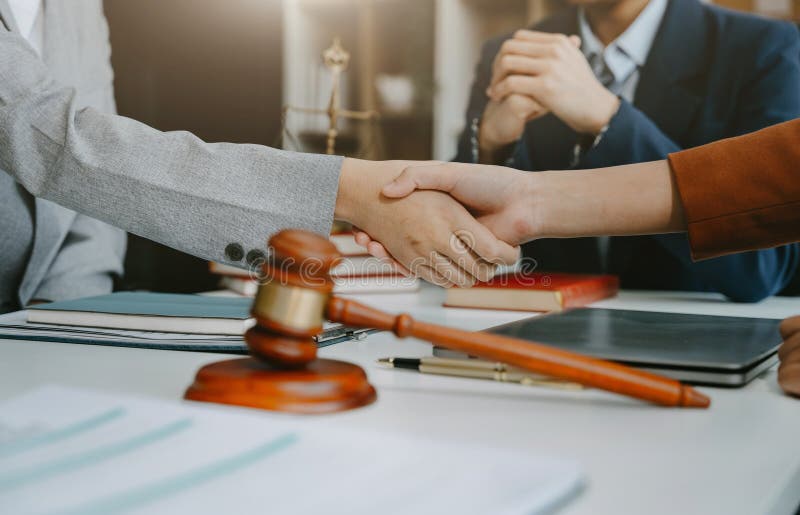 Lawyer Shaking Hands with Client after Discussing Final Contract ...