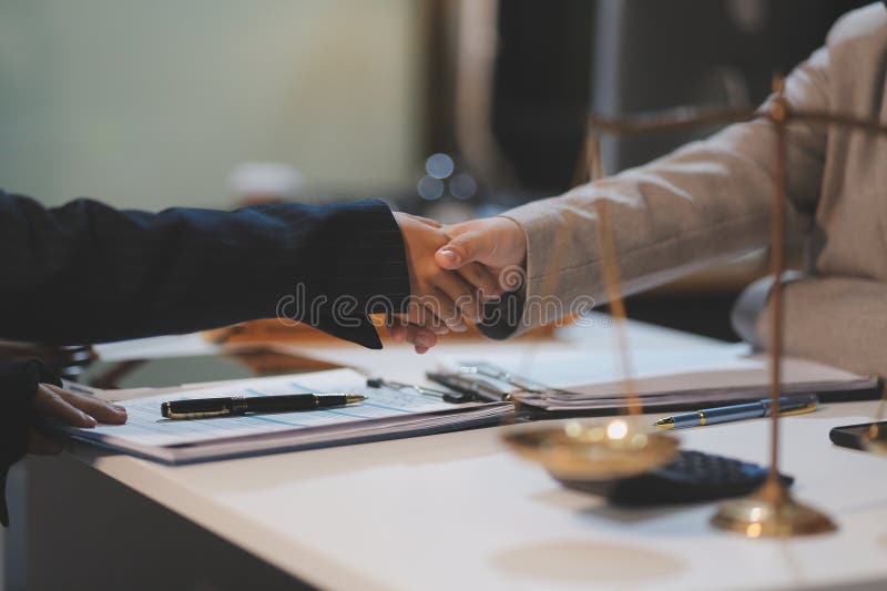 Lawyer Shaking Hands with a Client Making about Documents, Contracts ...